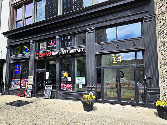 Neon dreams and seafood schemes! Crab 99's storefront beckons like a lighthouse for hungry sailors, promising oceanic delights in the heart of downtown Indy.