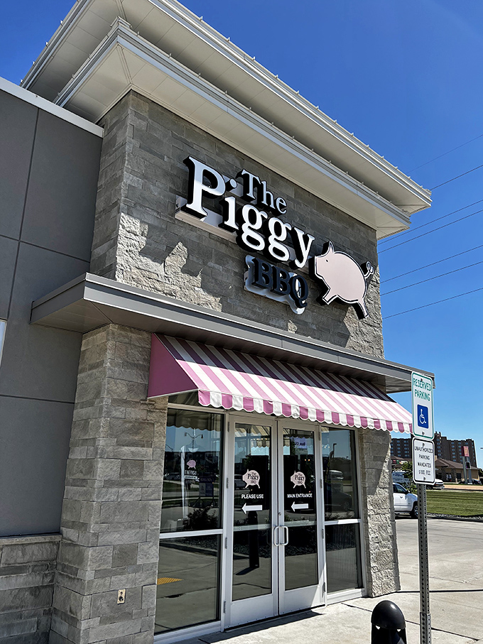 Welcome to pork paradise! The Piggy BBQ's exterior promises a feast for the senses, with its inviting awning and playful pig logo.