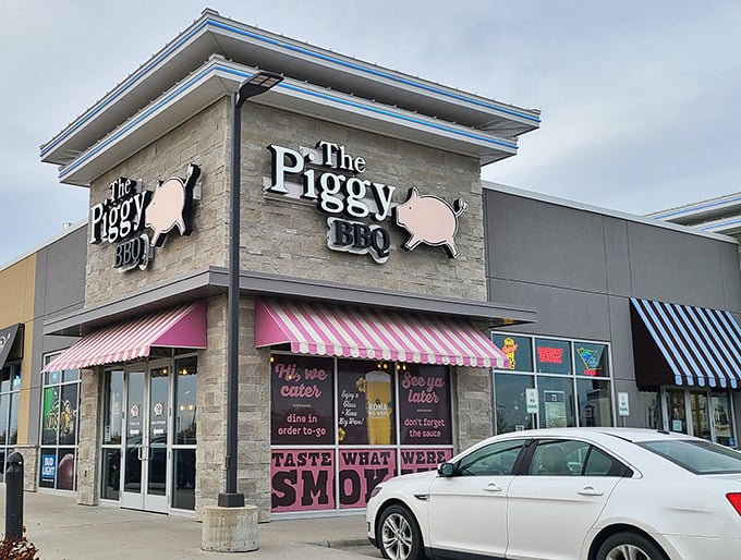 Welcome to pork paradise! The Piggy BBQ's exterior promises a feast for the senses, with its inviting awning and playful pig logo.