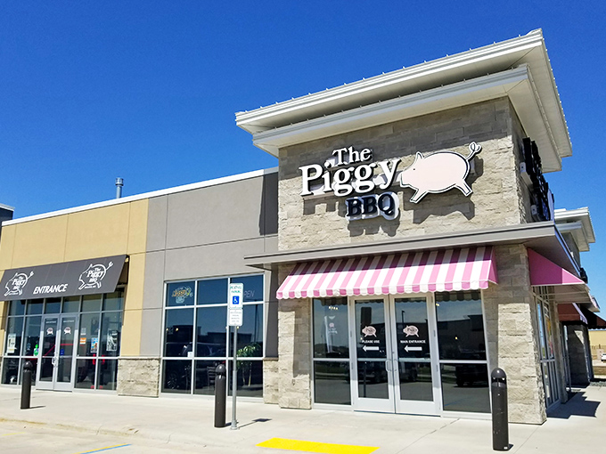 Welcome to pork paradise! The Piggy BBQ's exterior promises a feast for the senses, with its inviting awning and playful pig logo.