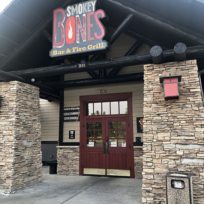 A rustic lodge or a barbecue haven? At Smokey Bones, it's deliciously both. This stone-faced facade promises a meaty adventure that'll make your taste buds do a happy dance.
