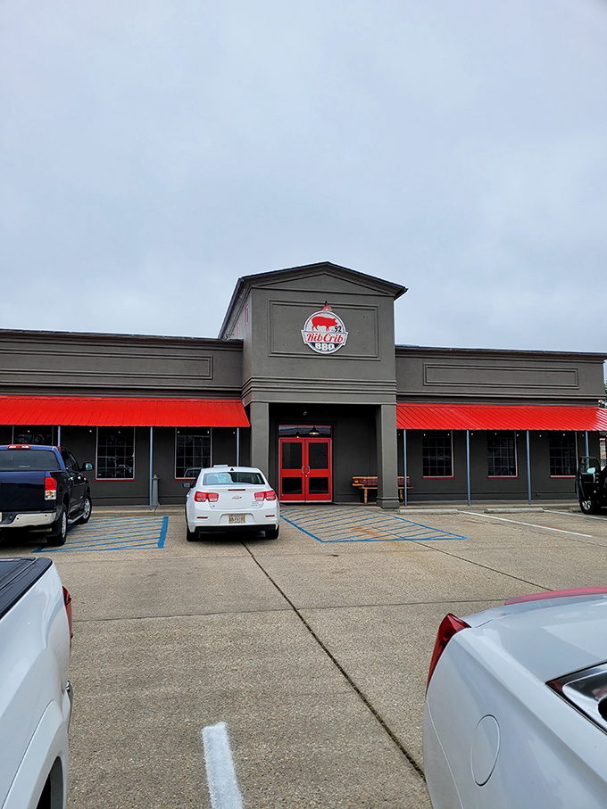 Welcome to BBQ paradise! RibCrib's exterior promises a smoky adventure, with its bold red awnings and inviting facade beckoning meat lovers from miles around.