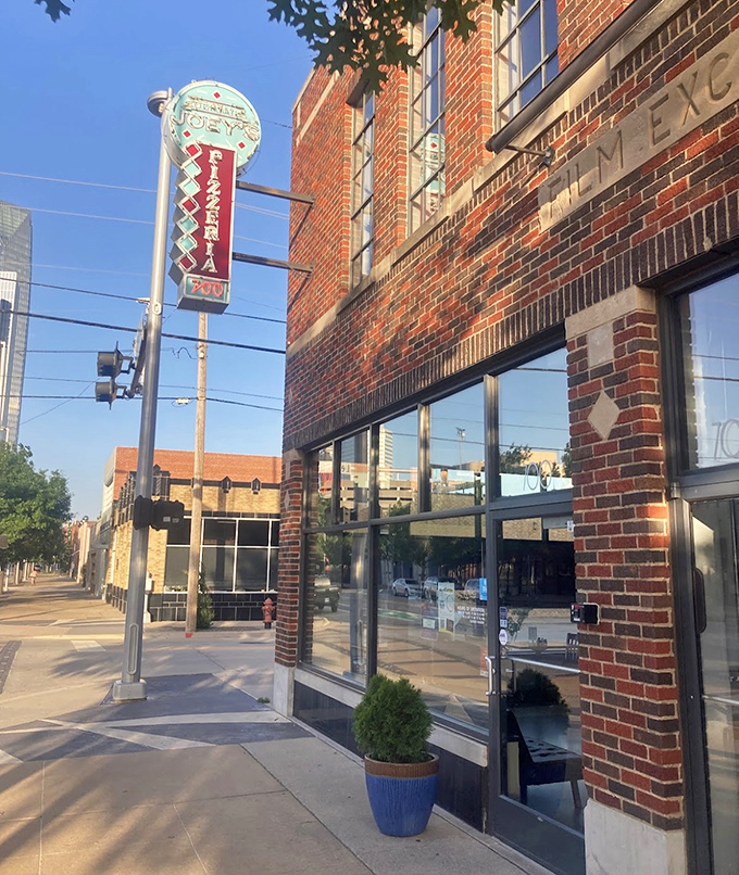 A neon beacon of cheesy delight! Joey's sign stands out like a pizza-shaped lighthouse, guiding hungry souls to their culinary destiny.