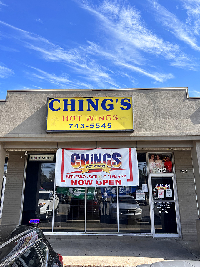 That bright yellow sign against the Memphis sky is like a beacon for wing lovers. No fancy frills, just a promise of deliciousness waiting inside.