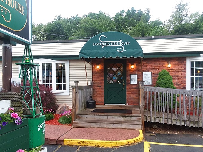 Welcome to seafood paradise! Saybrook Fish House's charming exterior promises a feast for the senses, like finding Atlantis in Connecticut.