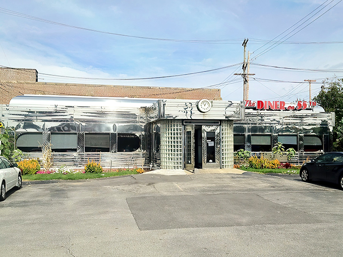 The gleaming stainless steel exterior shines like a beacon of breakfast hope, complete with classic glass block windows and vintage clock.