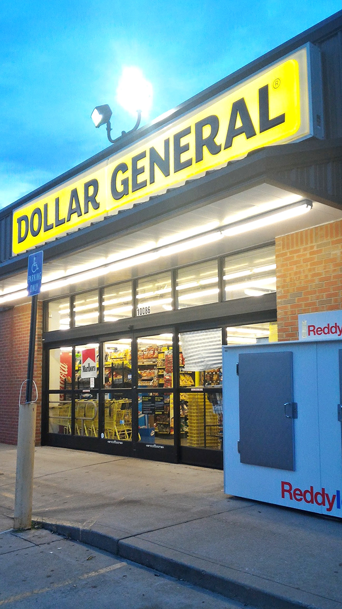 The iconic yellow sign against a clear Tennessee sky&mdash;Dollar General's brick-and-mortar promise of bargains beckons shoppers like a budget-friendly lighthouse.