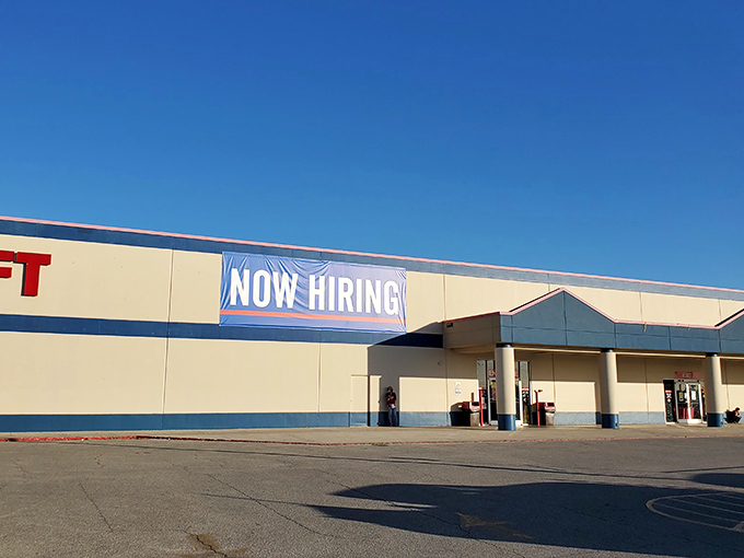 "Now Hiring" - a sign of the times or an invitation to join the treasure hunt? This thrift store's exterior promises adventures in bargain-hunting.