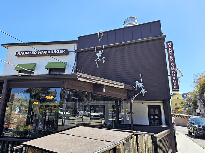 Who needs a stairway to heaven when you've got skeleton climbers scaling the Haunted Hamburger? This quirky exterior is a feast for the eyes and a promise of delicious adventures within.