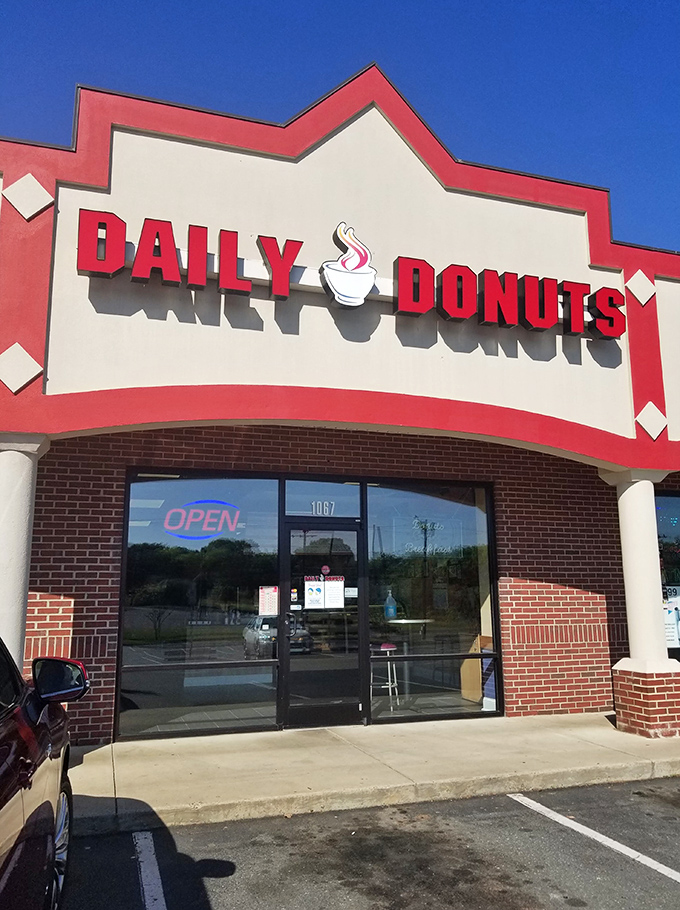 Welcome to donut paradise! Daily Donuts' cheery red sign promises a sugar-coated adventure that'll make your taste buds do a happy dance.