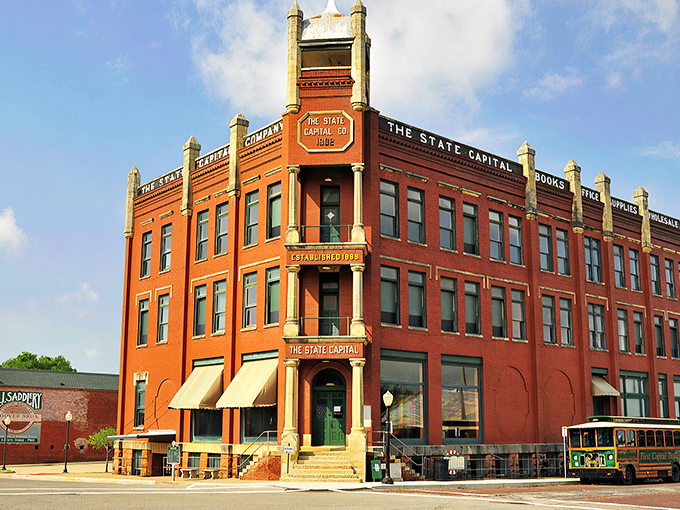 "Welcome to Guthrie: Where History Meets Hallmark!" This charming street scene could double as a movie set, with its ornate architecture and quaint storefronts straight out of a nostalgic dream.