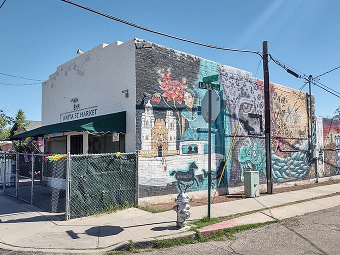 Mural magic! This vibrant street art isn't just eye candy &ndash; it's your appetizer for the flavor fiesta waiting inside Anita Street Market. Talk about a colorful welcome!