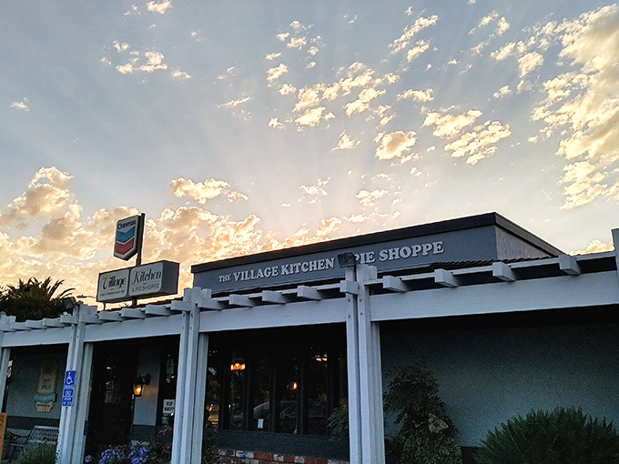 Welcome to pie paradise! The Village Kitchen & Pie Shoppe beckons with its charming exterior and the promise of heavenly treats within.