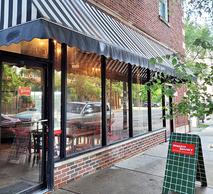 Welcome to pie paradise! Bang Bang's storefront is like a siren call to carb-lovers, with its striped awning and promise of buttery bliss.