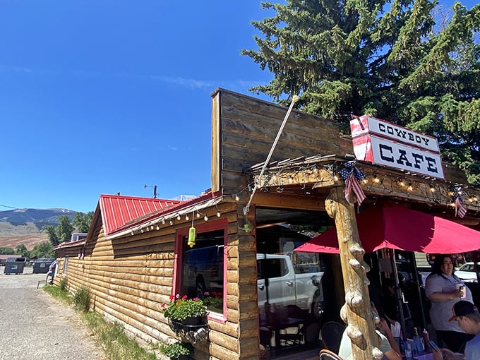 Step into a time machine disguised as a cafe! The Cowboy Cafe's rustic charm and vibrant red umbrella beckon you to saddle up for a taste of the Wild West.