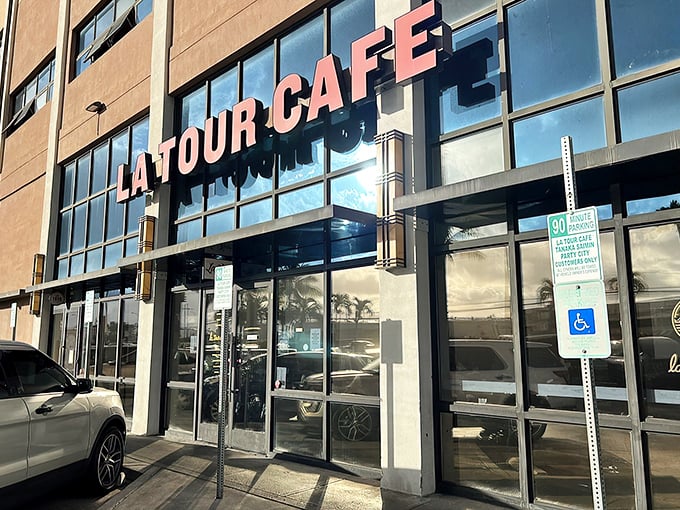 Welcome to La Tour Cafe, where the exterior is as inviting as a warm Hawaiian breeze. This unassuming facade hides a world of culinary delights waiting to be discovered.