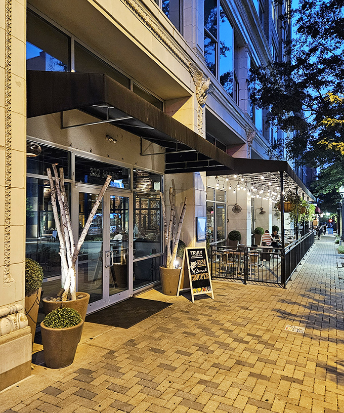 Twilight transforms Samantha's patio into an urban oasis. The string lights and lush greenery create the perfect backdrop for that "I need to Instagram this" moment.
