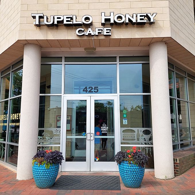 The warm, inviting fa&ccedil;ade of Tupelo Honey beckons with blue planters standing guard like Southern sentinels ready to welcome hungry visitors. 
