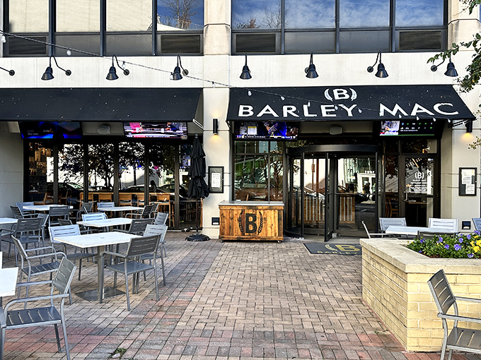 Barley Mac's inviting exterior beckons with modern charm and a patio that practically whispers, "Come sit awhile and forget your inbox exists."