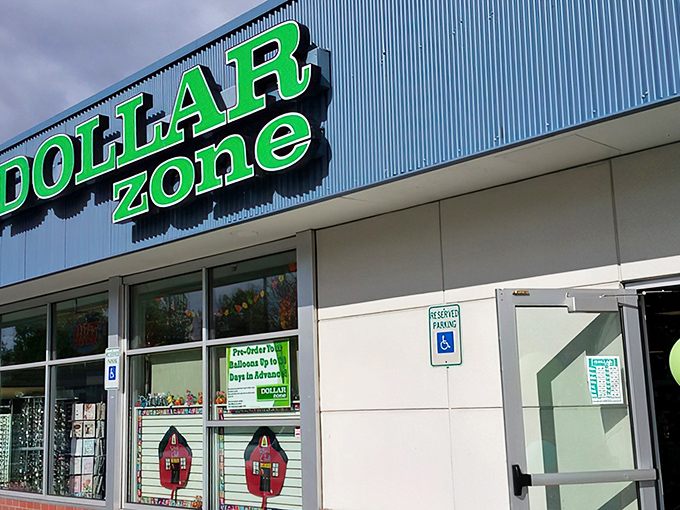 The iconic blue and green Dollar Zone sign beckons like a budget-friendly lighthouse in Anchorage's retail sea. Bargain hunters, your port awaits!