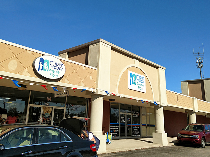 Welcome to the treasure trove! Open Door Thrift Store's inviting facade promises a world of secondhand wonders waiting to be discovered inside.