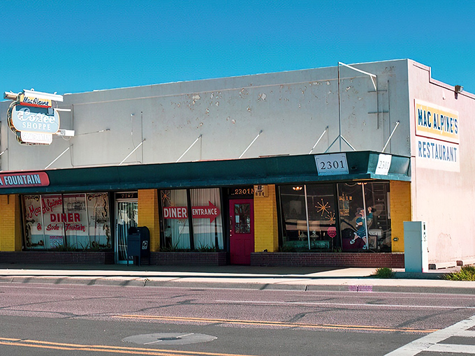 Sunshine on a storefront! MacAlpine's yellow exterior is like a beacon of retro joy, beckoning you to step back in time and indulge in some classic Americana.