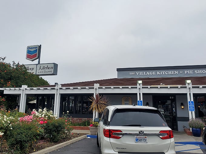 Welcome to pie paradise! The Village Kitchen & Pie Shoppe beckons with its charming exterior and the promise of heavenly treats within.