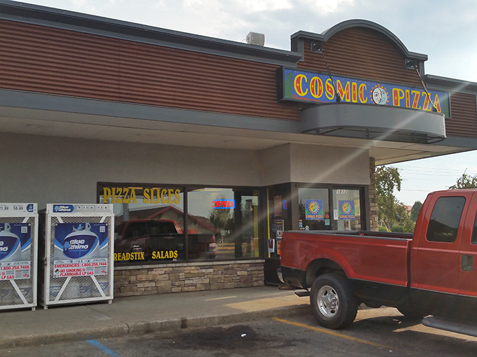 Welcome to the cosmos! Cosmic Pizza's vibrant storefront promises a journey through flavor galaxies far, far away.