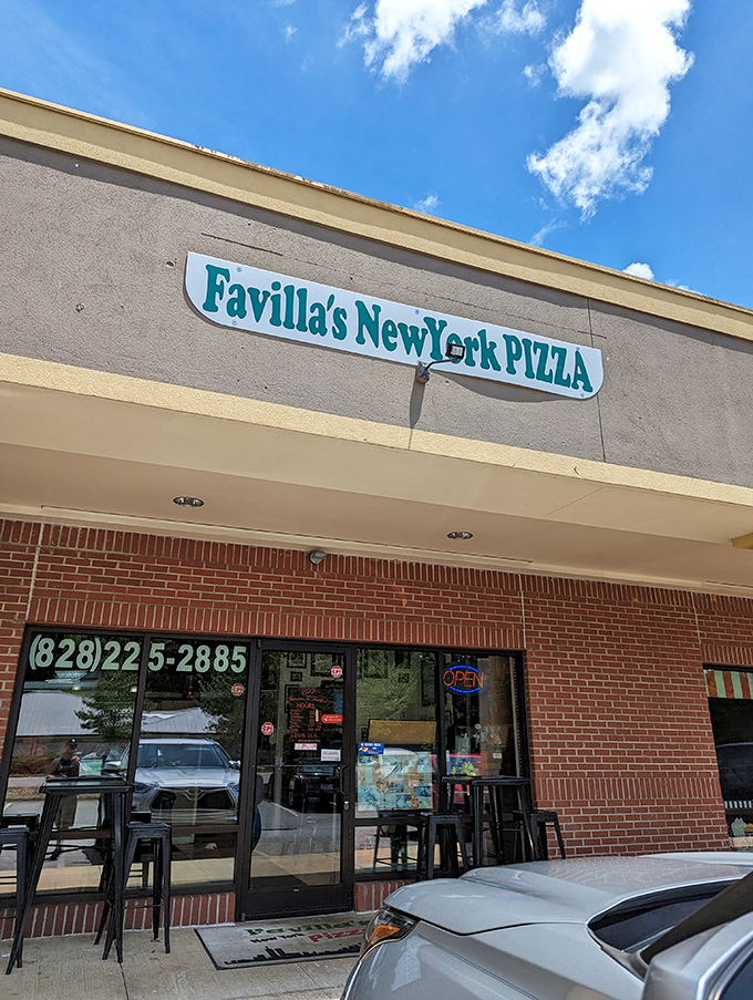 A slice of the Big Apple in Asheville! Favilla's neon sign beckons pizza lovers like a lighthouse guiding hungry sailors home.