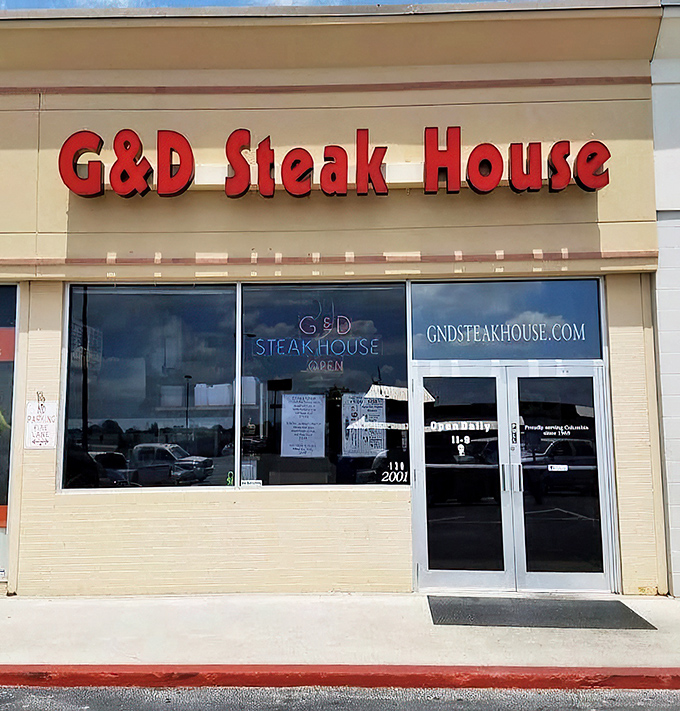 "G&D Steak House: Where the steaks are so good, they don't need fancy frills." This unassuming exterior hides a carnivore's paradise, proving that sometimes the best things come in simple packages.