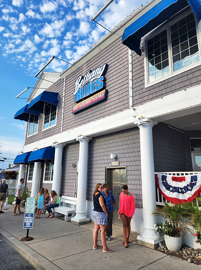The blue-shingled beacon of BBQ excellence stands proud on Coastal Highway, its classic beach architecture promising smoky delights within these Delaware shores.