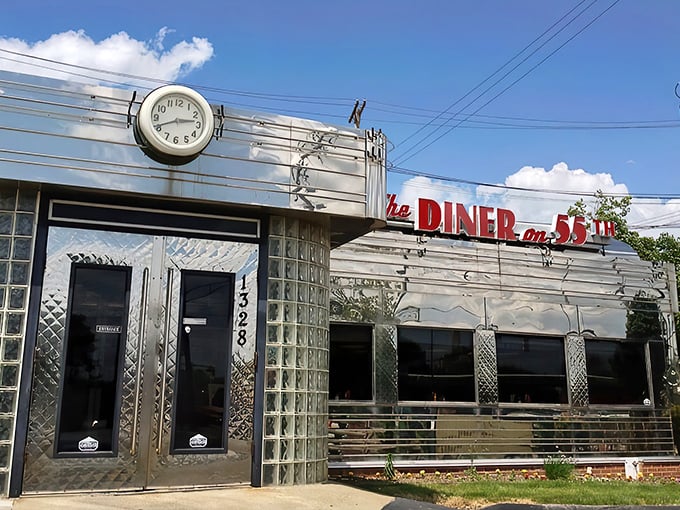 The gleaming stainless steel exterior shines like a beacon of breakfast hope, complete with classic glass block windows and vintage clock.