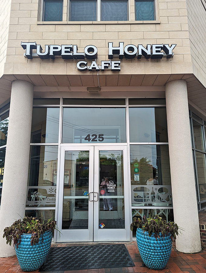 The warm, inviting fa&ccedil;ade of Tupelo Honey beckons with blue planters standing guard like Southern sentinels ready to welcome hungry visitors. 