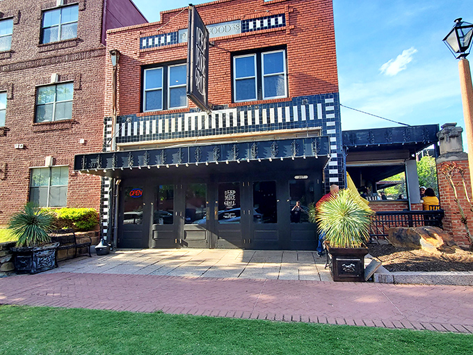 Brick and mortar never looked so inviting! Deep Deuce Grill's exterior is like a warm hug from your favorite aunt, promising comfort food and good times inside.