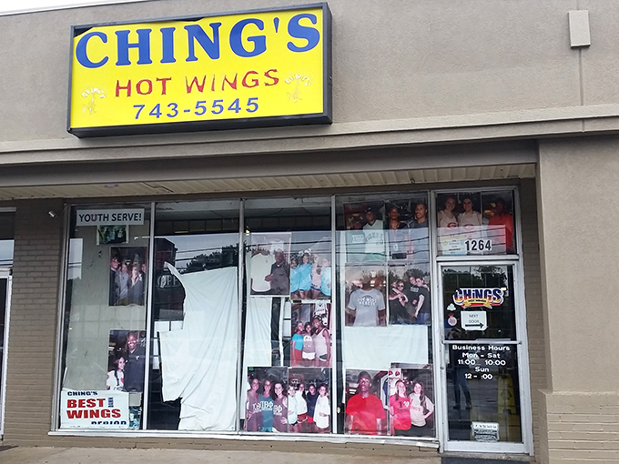 That bright yellow sign against the Memphis sky is like a beacon for wing lovers. No fancy frills, just a promise of deliciousness waiting inside.