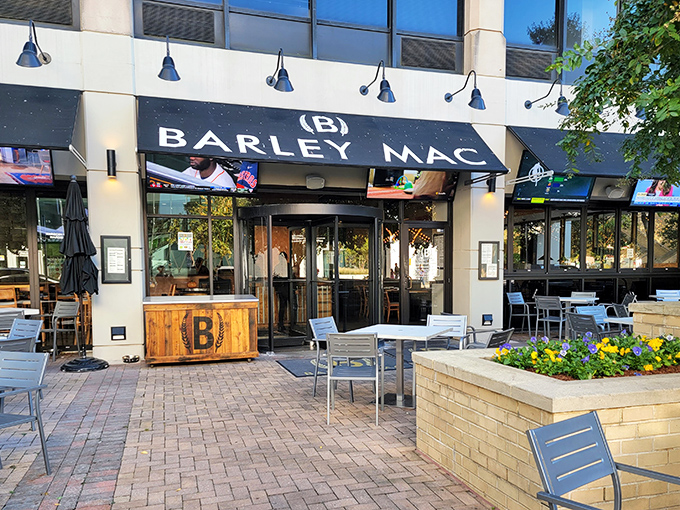 Barley Mac's inviting exterior beckons with modern charm and a patio that practically whispers, "Come sit awhile and forget your inbox exists."