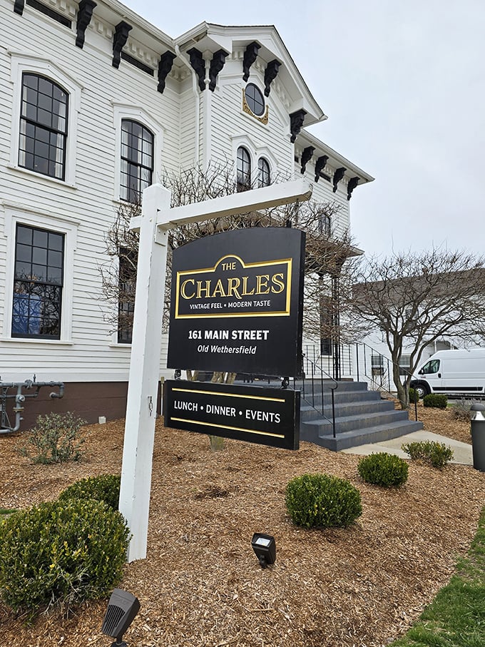 A storybook come to life! The Charles stands proud in Old Wethersfield, its white facade and ornate details whispering tales of bygone eras and modern culinary delights.