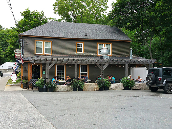 Welcome to flavor town! Krista's charming exterior invites you in with its cozy porch and colorful flag, promising a feast for all senses.