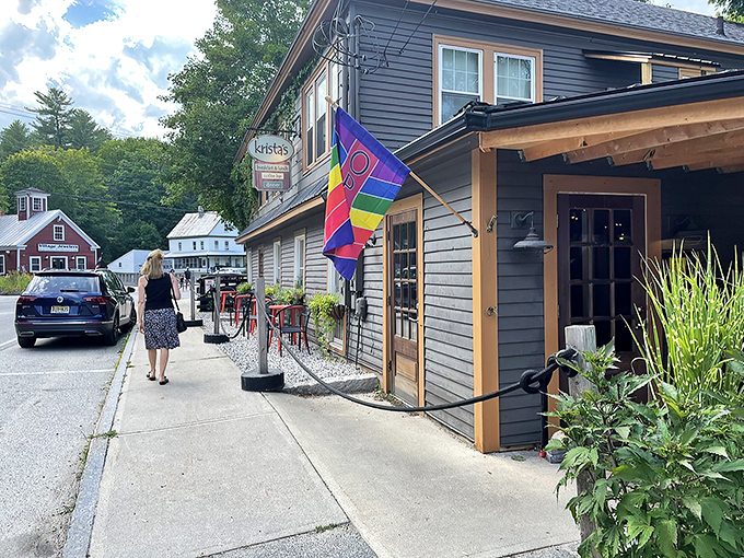 Welcome to flavor town! Krista's charming exterior invites you in with its cozy porch and colorful flag, promising a feast for all senses.