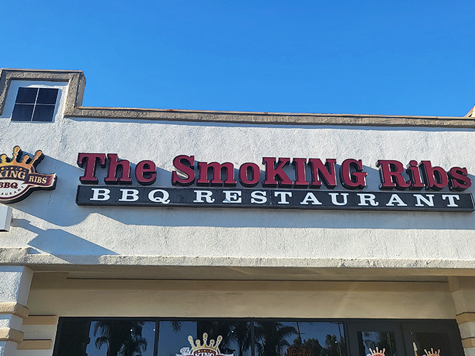Welcome to flavor town! The Smoking Ribs' bold signage promises a smoky paradise that'll have your taste buds doing a happy dance.