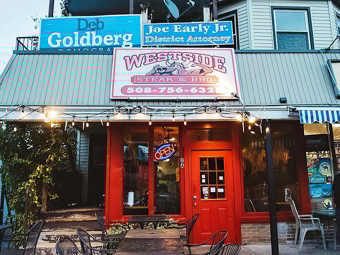 A red door to flavor paradise! This vibrant entrance is like a culinary red carpet, inviting you to step into a world of mouthwatering barbecue delights.