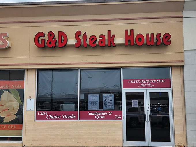 "G&D Steak House: Where the steaks are so good, they don't need fancy frills." This unassuming exterior hides a carnivore's paradise, proving that sometimes the best things come in simple packages.