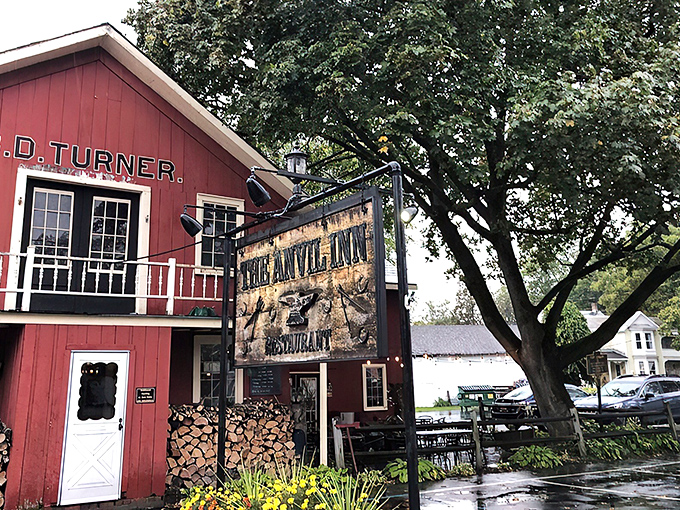A red barn that's not for cows, but for carnivores! The Anvil Inn's exterior promises a cozy retreat for steak lovers.