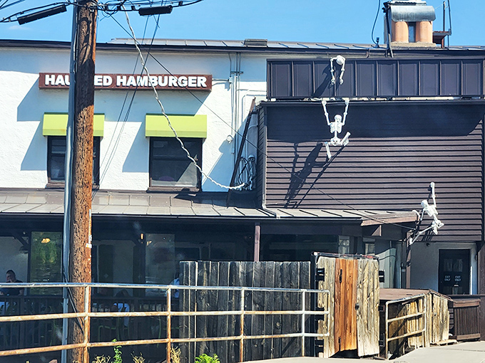 Who needs a stairway to heaven when you've got skeleton climbers scaling the Haunted Hamburger? This quirky exterior is a feast for the eyes and a promise of delicious adventures within.