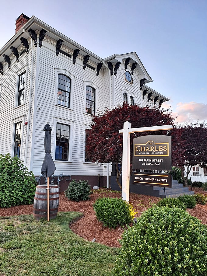 A storybook come to life! The Charles stands proud in Old Wethersfield, its white facade and ornate details whispering tales of bygone eras and modern culinary delights.