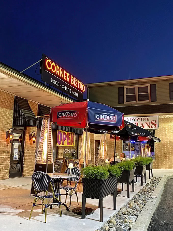 A slice of Parisian charm in Wilmington! Corner Bistro's inviting facade promises culinary delights and cozy evenings under those chic Cinzano umbrellas.