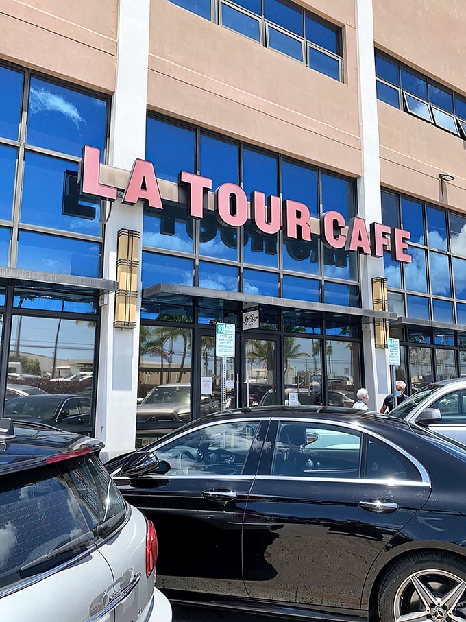 Welcome to La Tour Cafe, where the exterior is as inviting as a warm Hawaiian breeze. This unassuming facade hides a world of culinary delights waiting to be discovered.