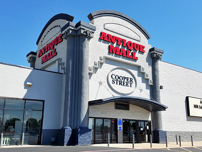 Welcome to the time machine! This isn't just any old store front - it's a portal to the past, beckoning you with its bold red letters and promise of treasures within.
