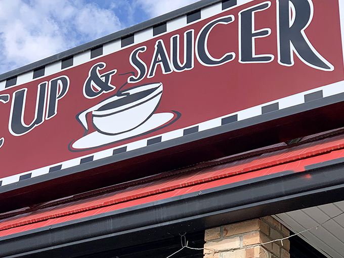 Welcome to flavor town! The Cup & Saucer's retro sign promises a journey back to the golden age of diners.