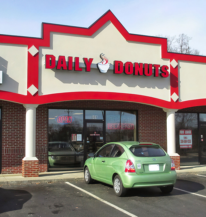 Welcome to donut paradise! Daily Donuts' cheery red sign promises a sugar-coated adventure that'll make your taste buds do a happy dance.